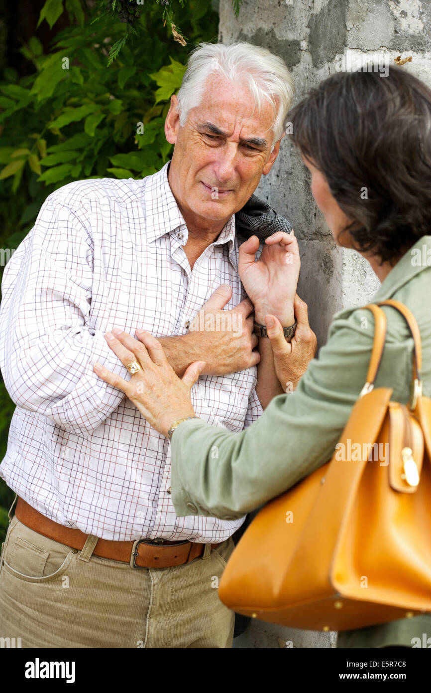 Old man outside chest pain hi-res stock photography and images - Alamy