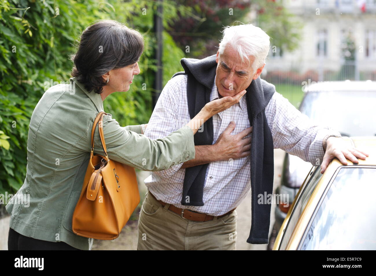 Old man outside chest pain hi-res stock photography and images - Alamy