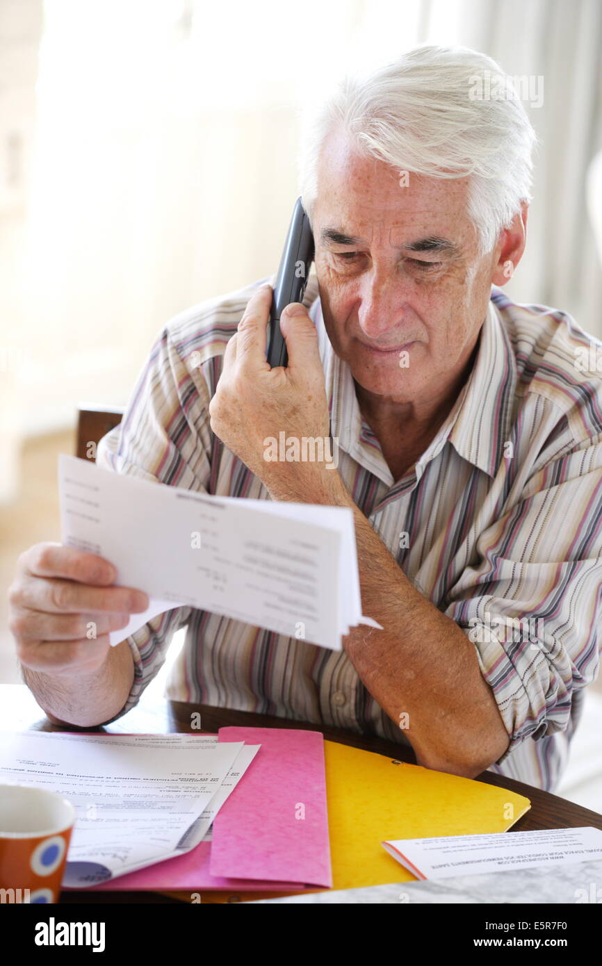 Senior person going through paperworks Stock Photo - Alamy