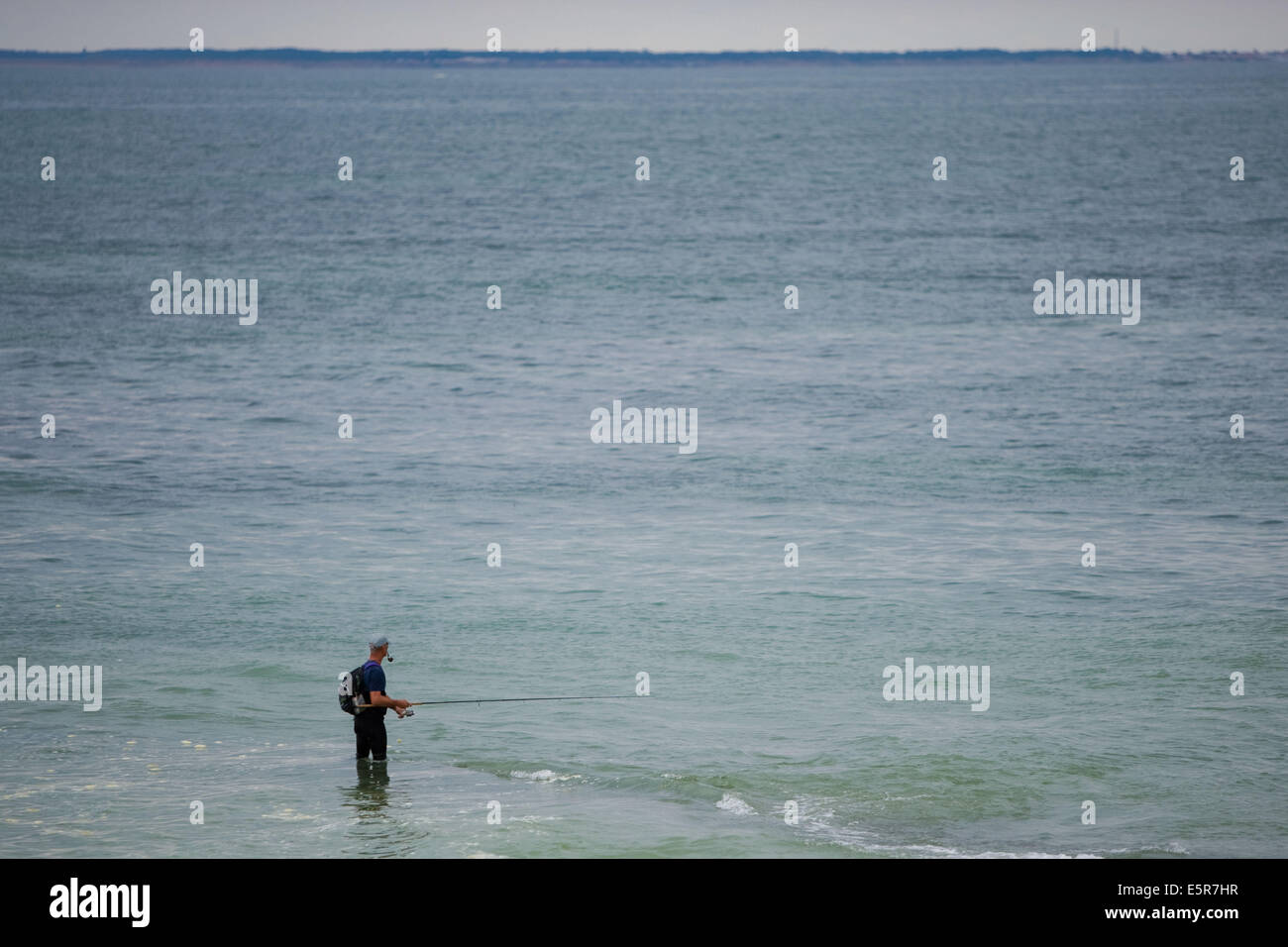 Man fishing with a fisher rod Stock Photo - Alamy