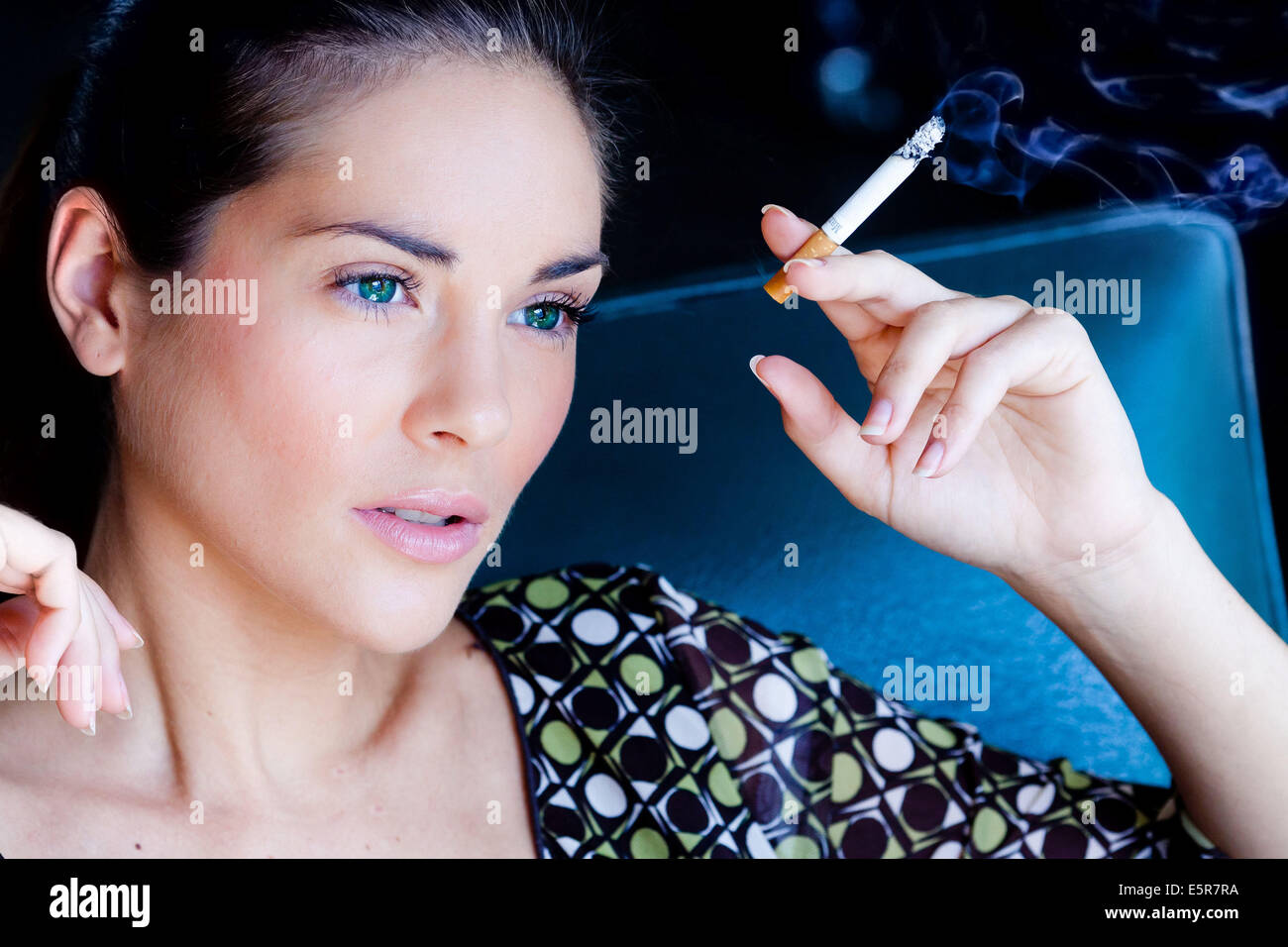 Woman smoking a cigarette Stock Photo - Alamy