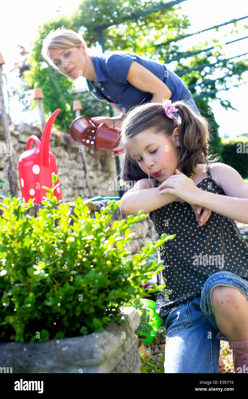 7 year old girl with painful or itchy arm Stock Photo - Alamy