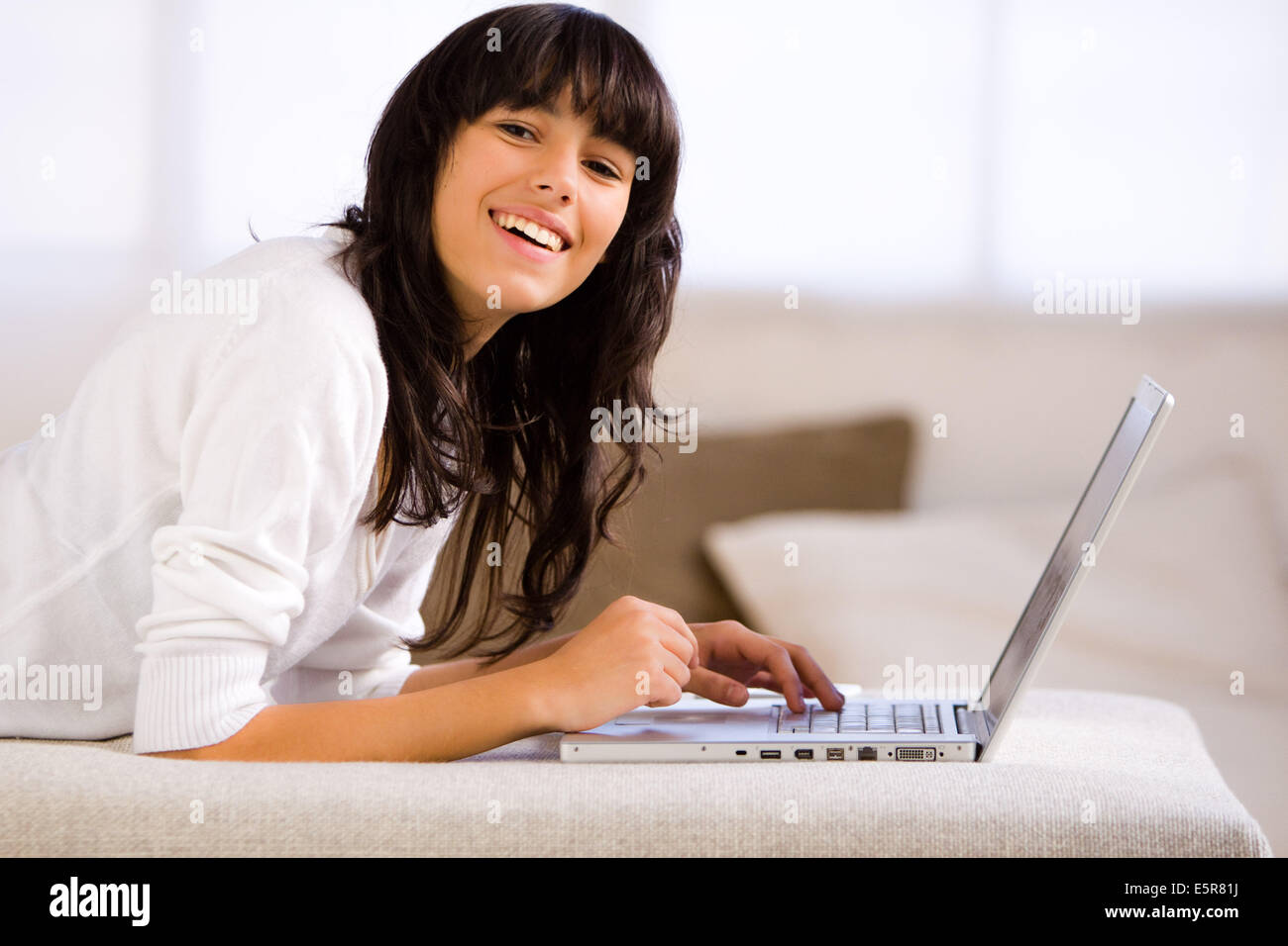 Teenage girl using a laptop computer Stock Photo - Alamy