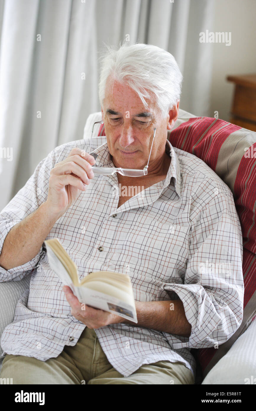 50 year old man reading a book hi-res stock photography and images - Alamy