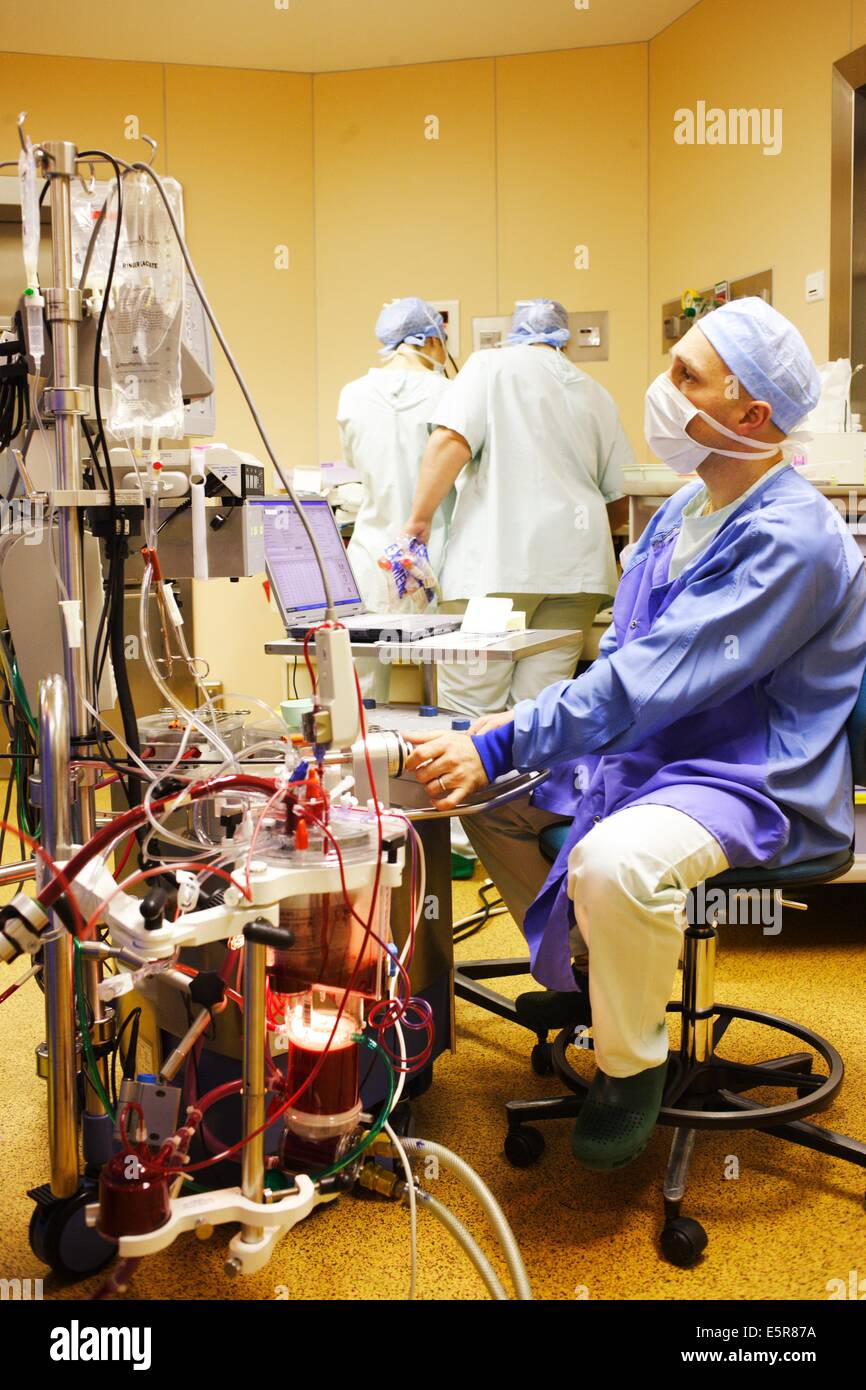 Anaesthesist at work during mitral valve replacement surgery, an open ...