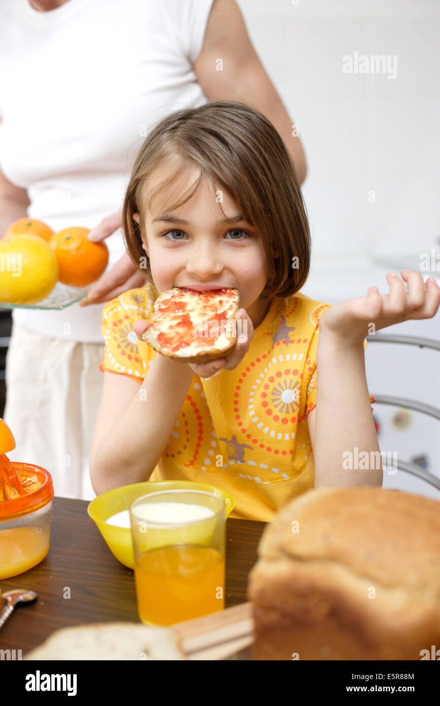 Child having breakfast or snack Stock Photo - Alamy
