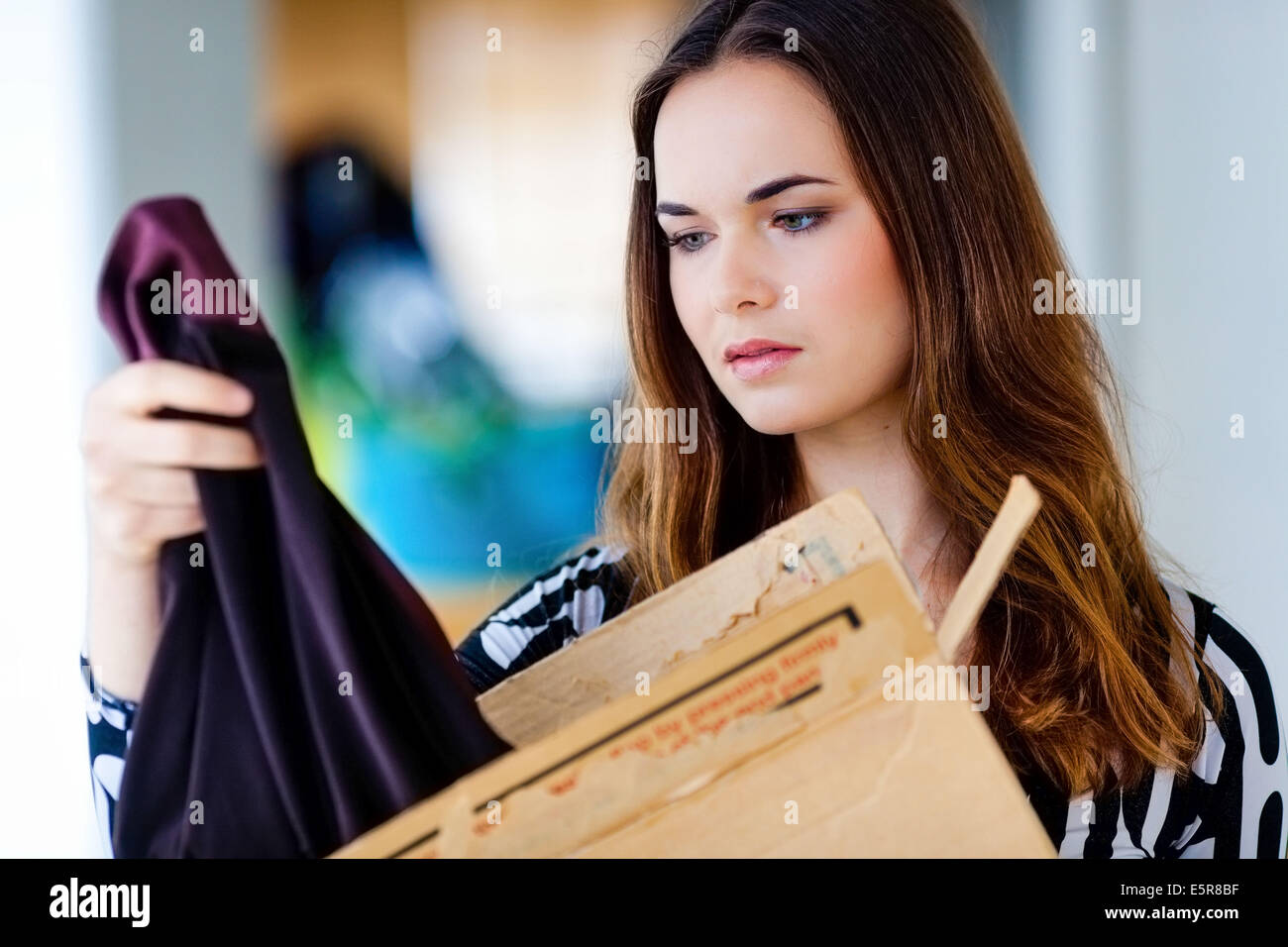 Woman receiving package Stock Photo - Alamy