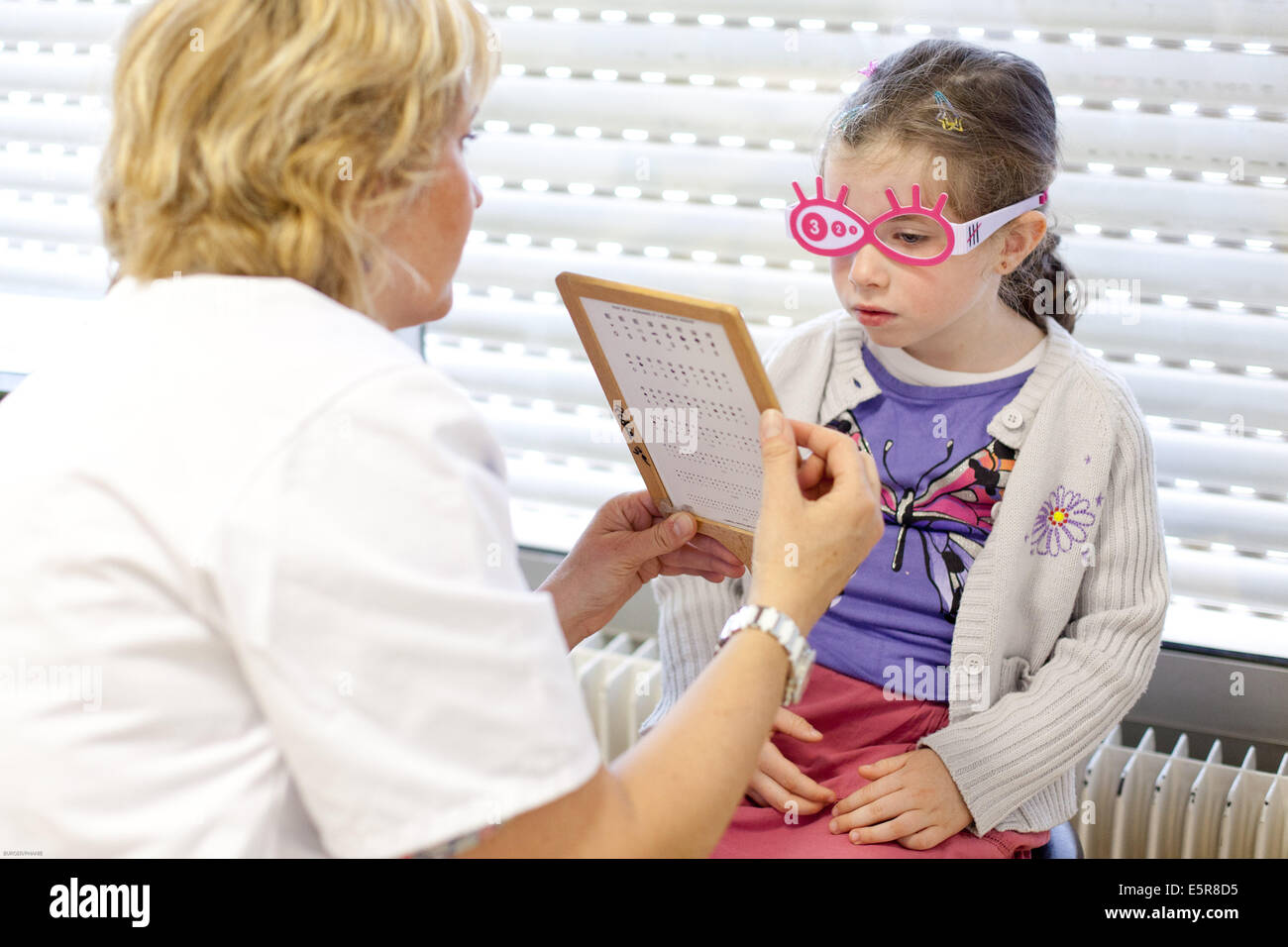Young girl undergoing orthoptic check-up with an orthoptist, Department ...