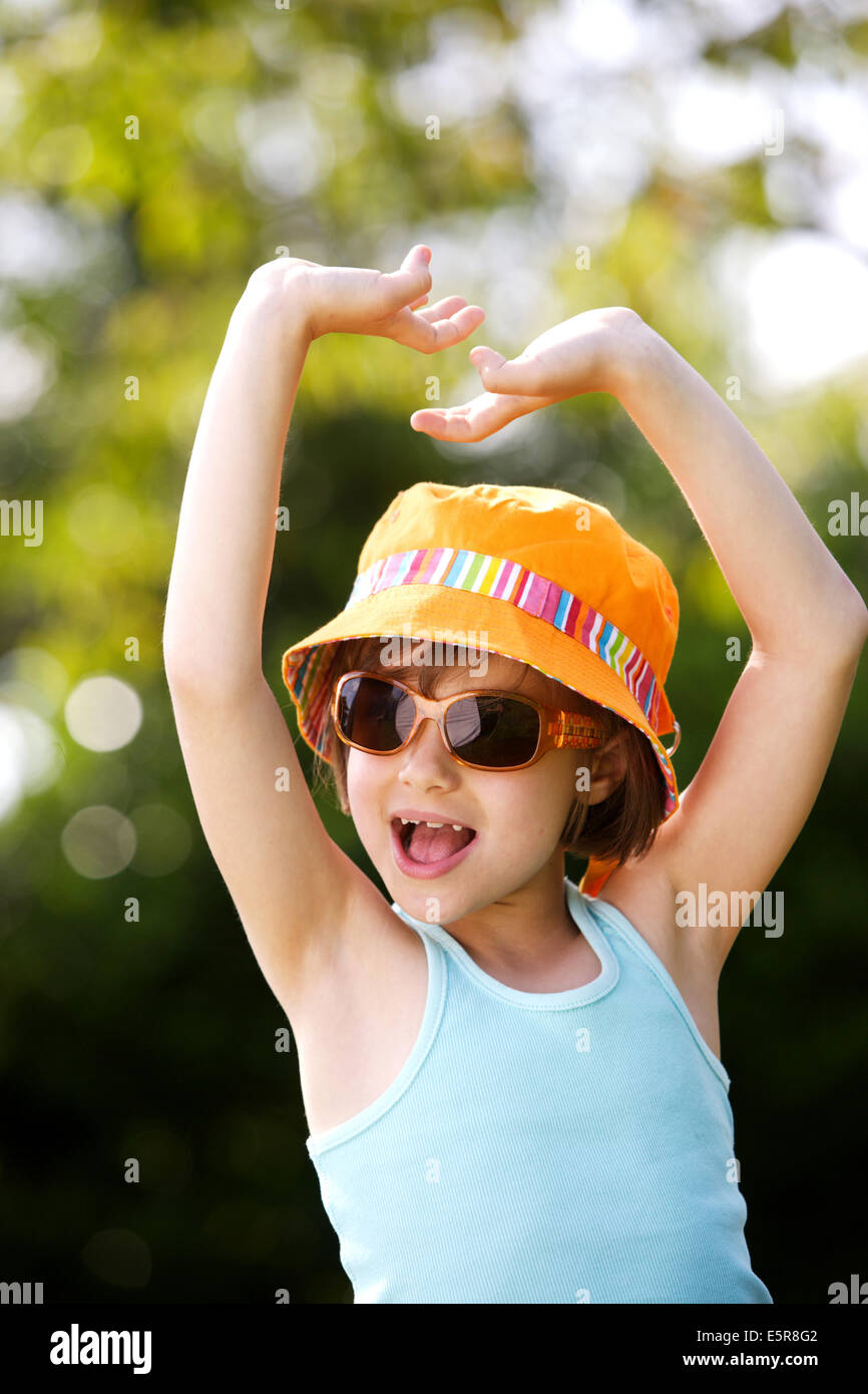 7 year old child arms up Stock Photo - Alamy