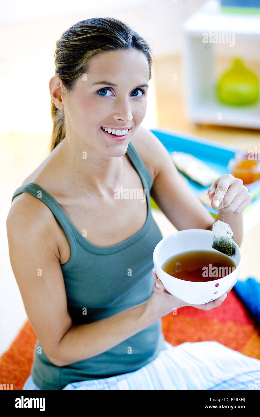 Woman drinking herbal tea Stock Photo - Alamy
