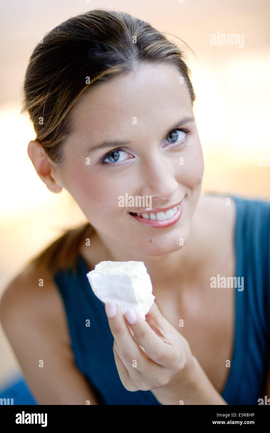 Woman eating camembert hi-res stock photography and images - Alamy