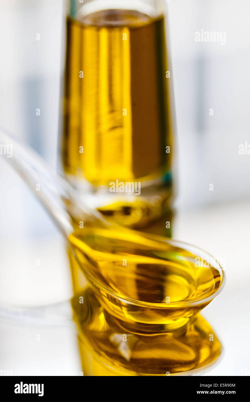 Spoon of oil Stock Photo - Alamy