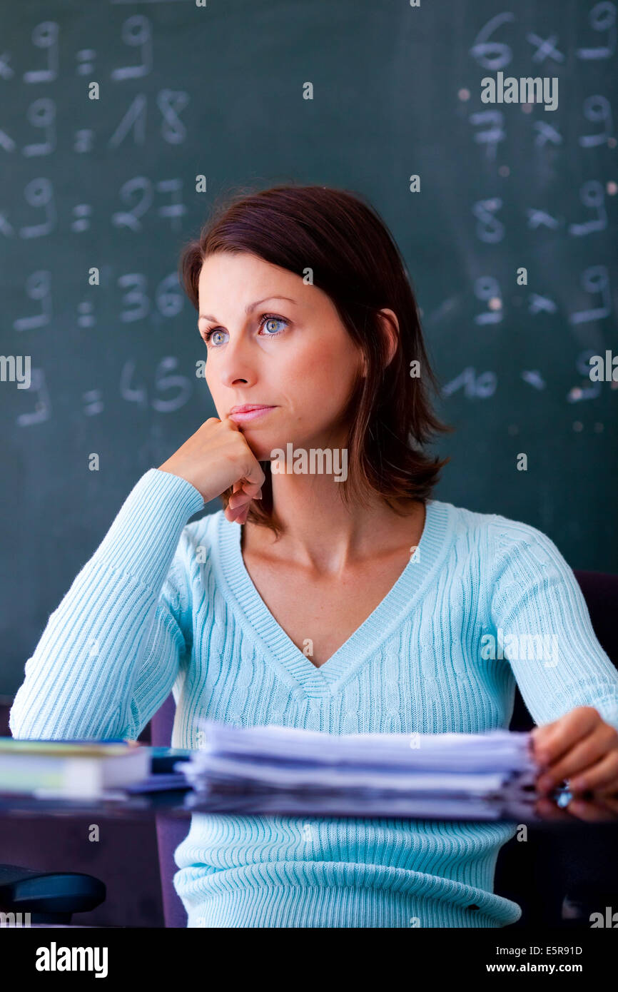 Teacher in a classroom Stock Photo - Alamy
