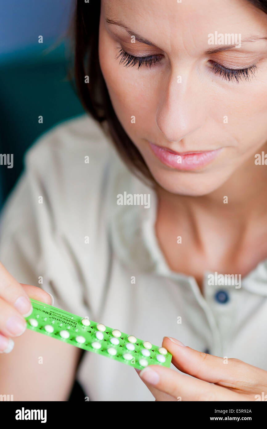 Woman with contraceptive pills Stock Photo - Alamy