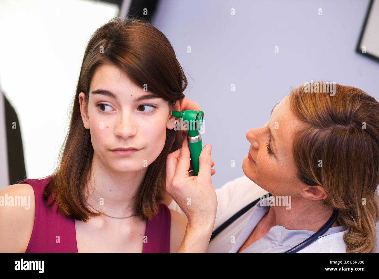 Nose and throat examination otoscope hi-res stock photography and ...