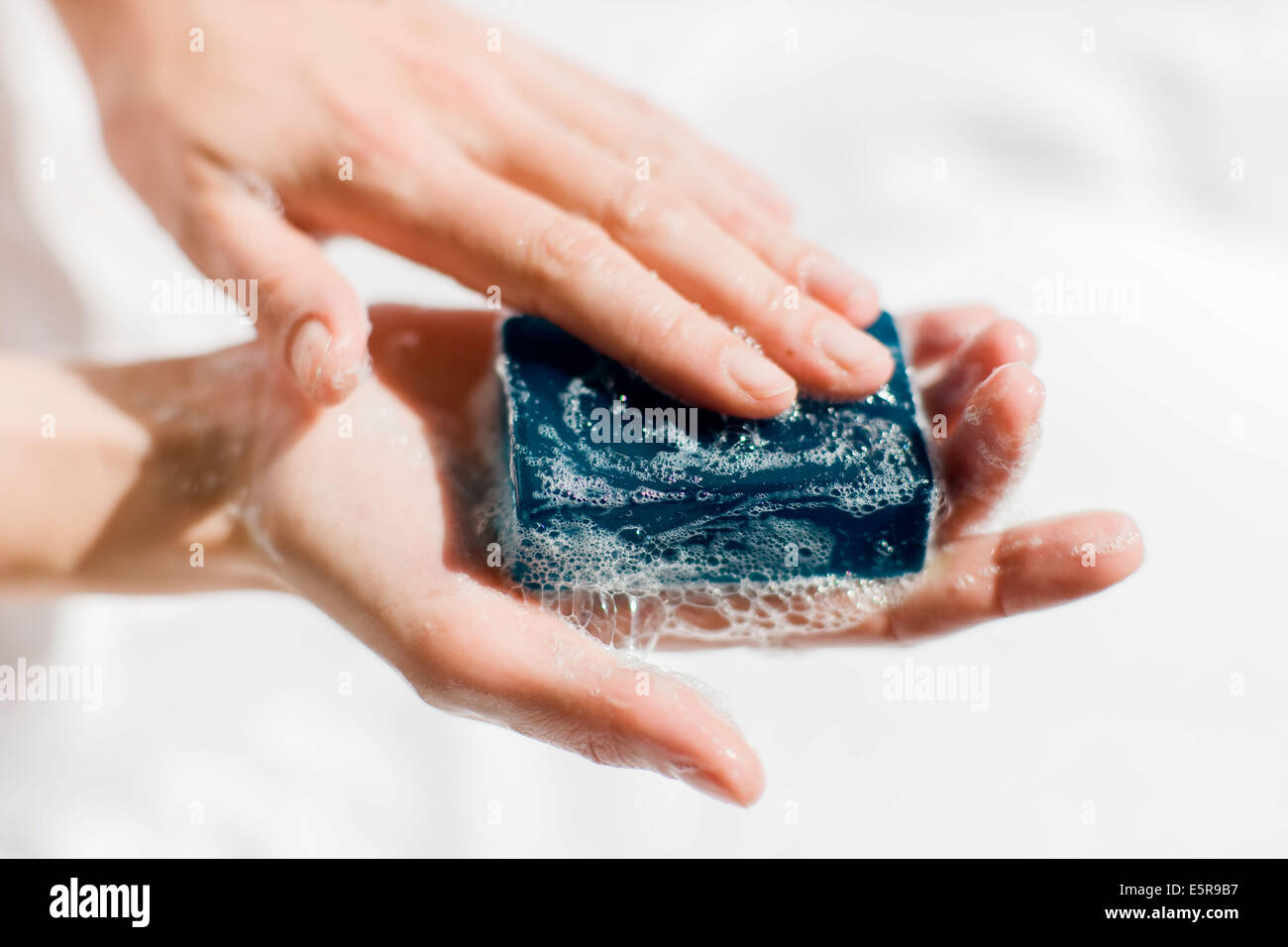 Woman washing hands with bar of soap Stock Photo - Alamy