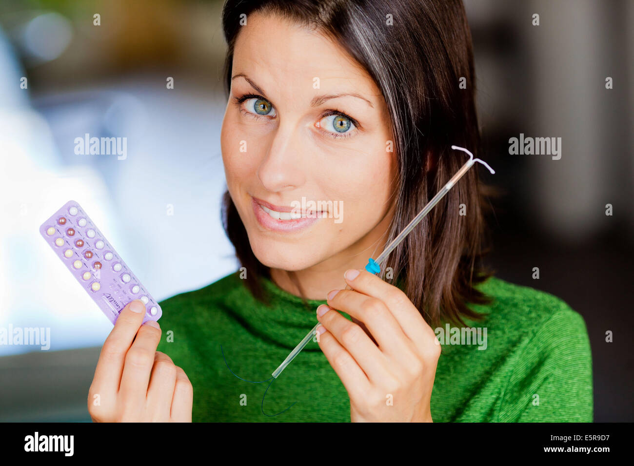 Woman holding various contraceptives Stock Photo - Alamy