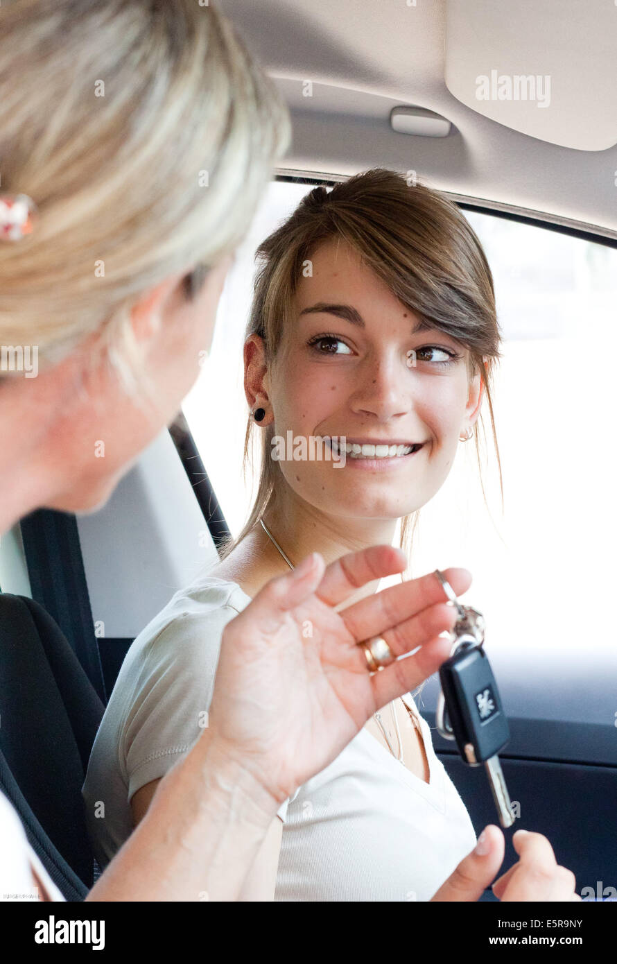Teeange girl learning how to drive with a driver instructor Stock Photo ...