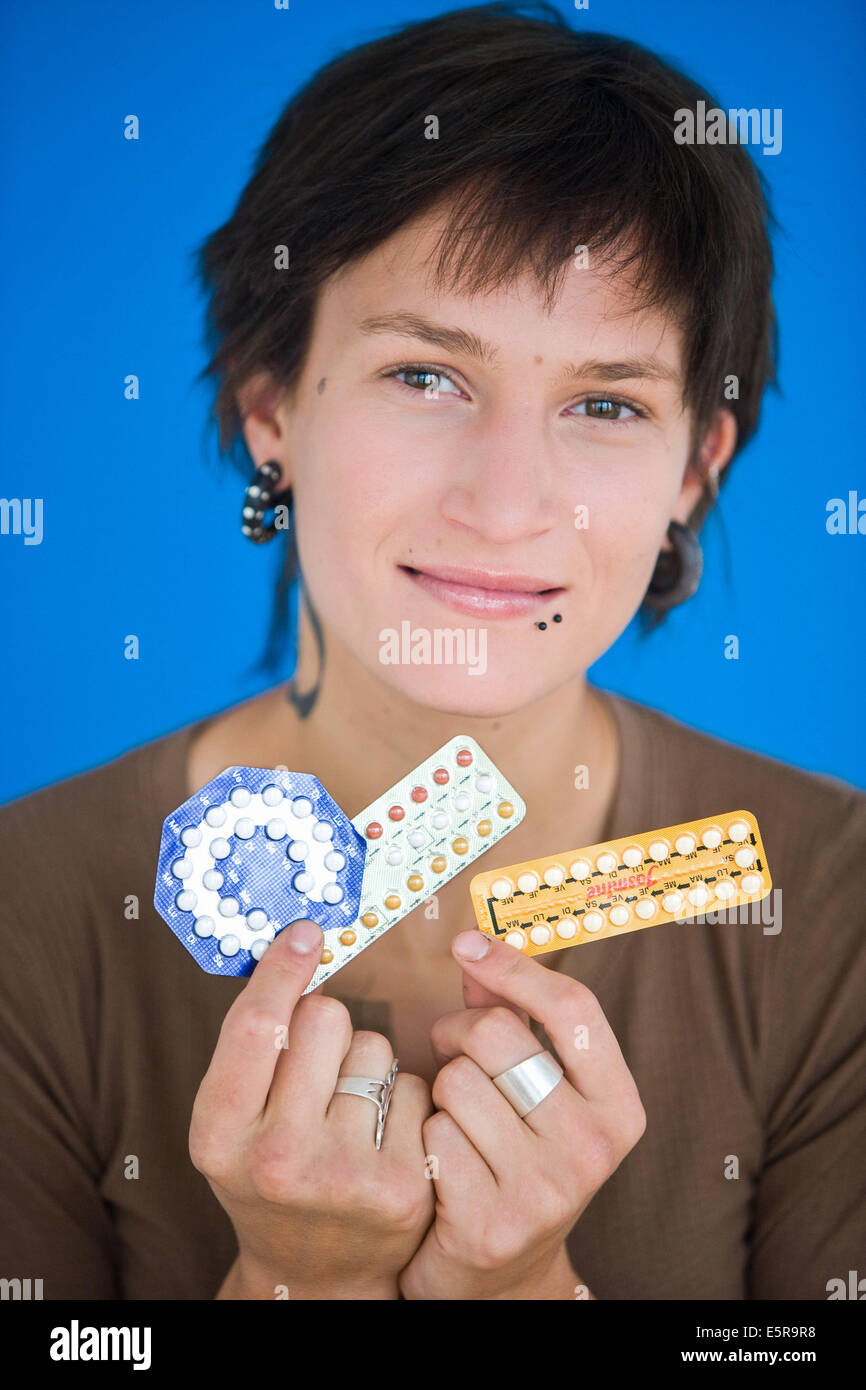 Woman with oral contraceptive pills Stock Photo - Alamy