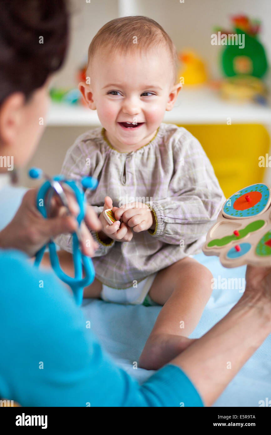 Doctor and 14 month old baby Stock Photo - Alamy
