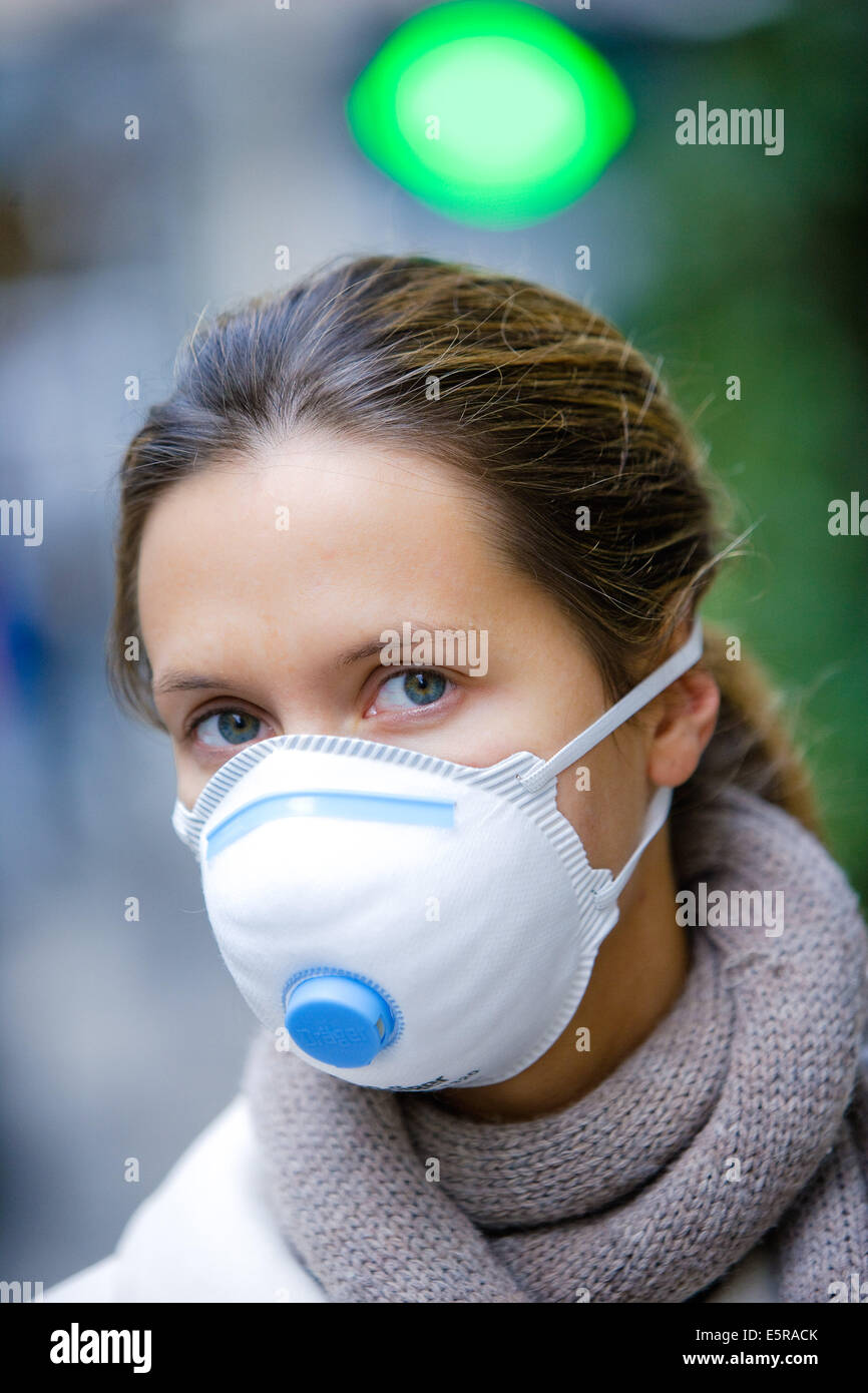 Woman wearing a protective breathing mask Stock Photo - Alamy