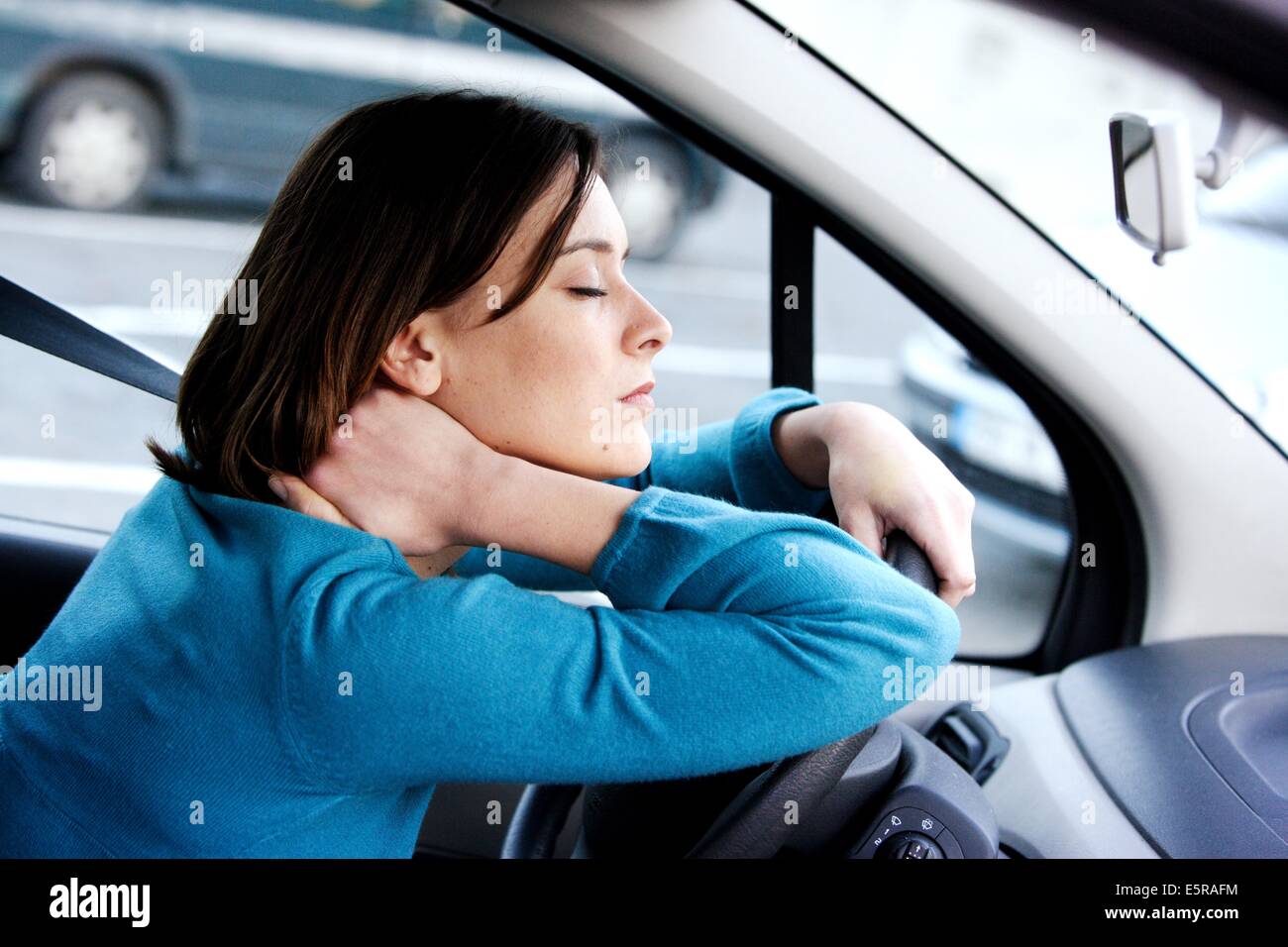 Driver suffering from neck pain Stock Photo - Alamy