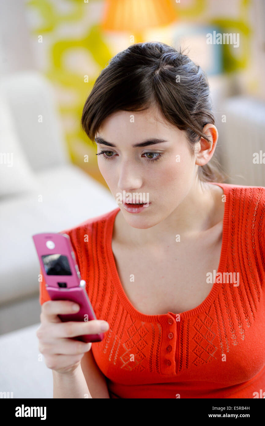 Woman using a cell phone Stock Photo - Alamy