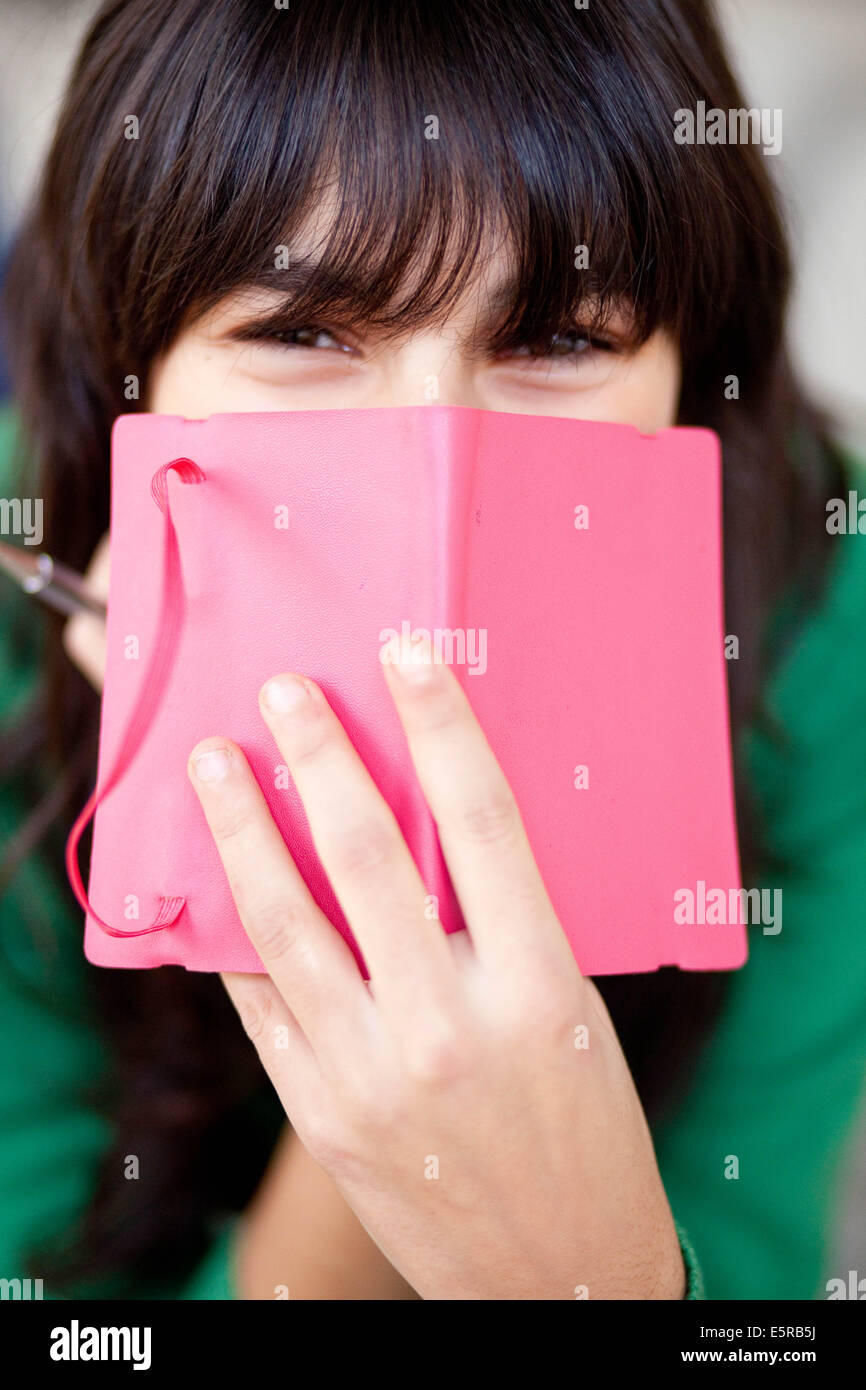 Teenage girl reading her diary Stock Photo - Alamy