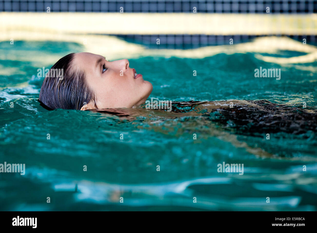Woman in swimming pool Stock Photo - Alamy