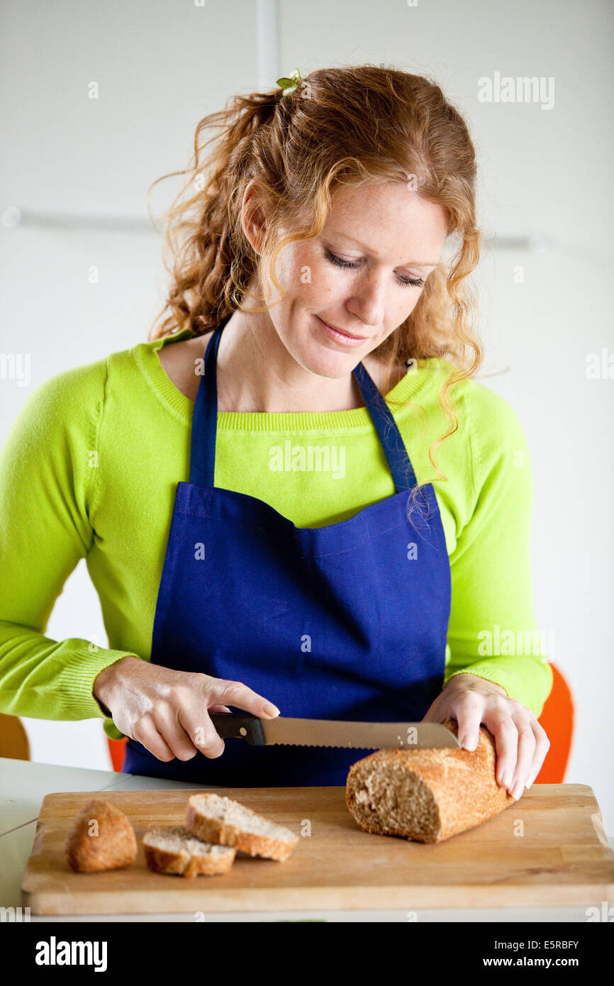 Woman eating bread Stock Photo - Alamy