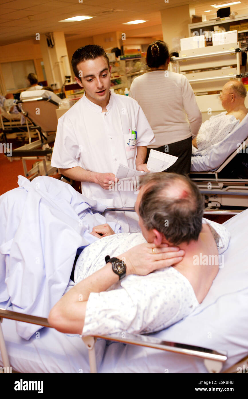 Patient attending to senior hospital hi-res stock photography and ...