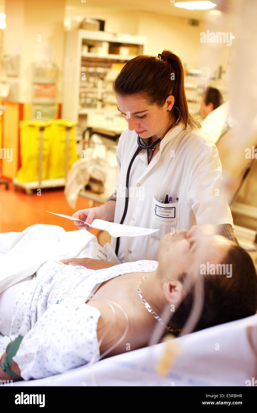 Intern doctor attending to patient, Emergency department, Limoges ...