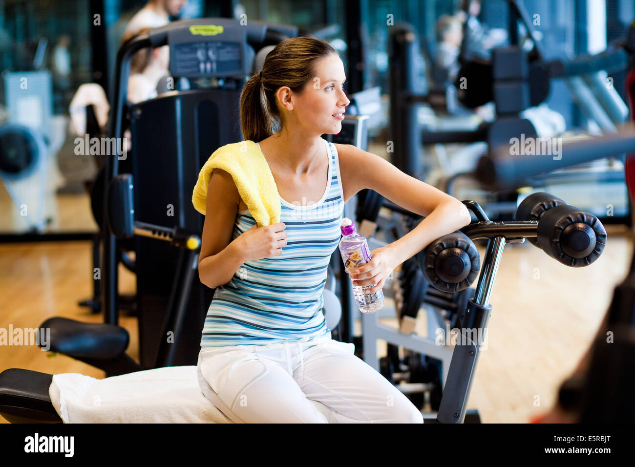 Woman taking a break at the gym Stock Photo - Alamy