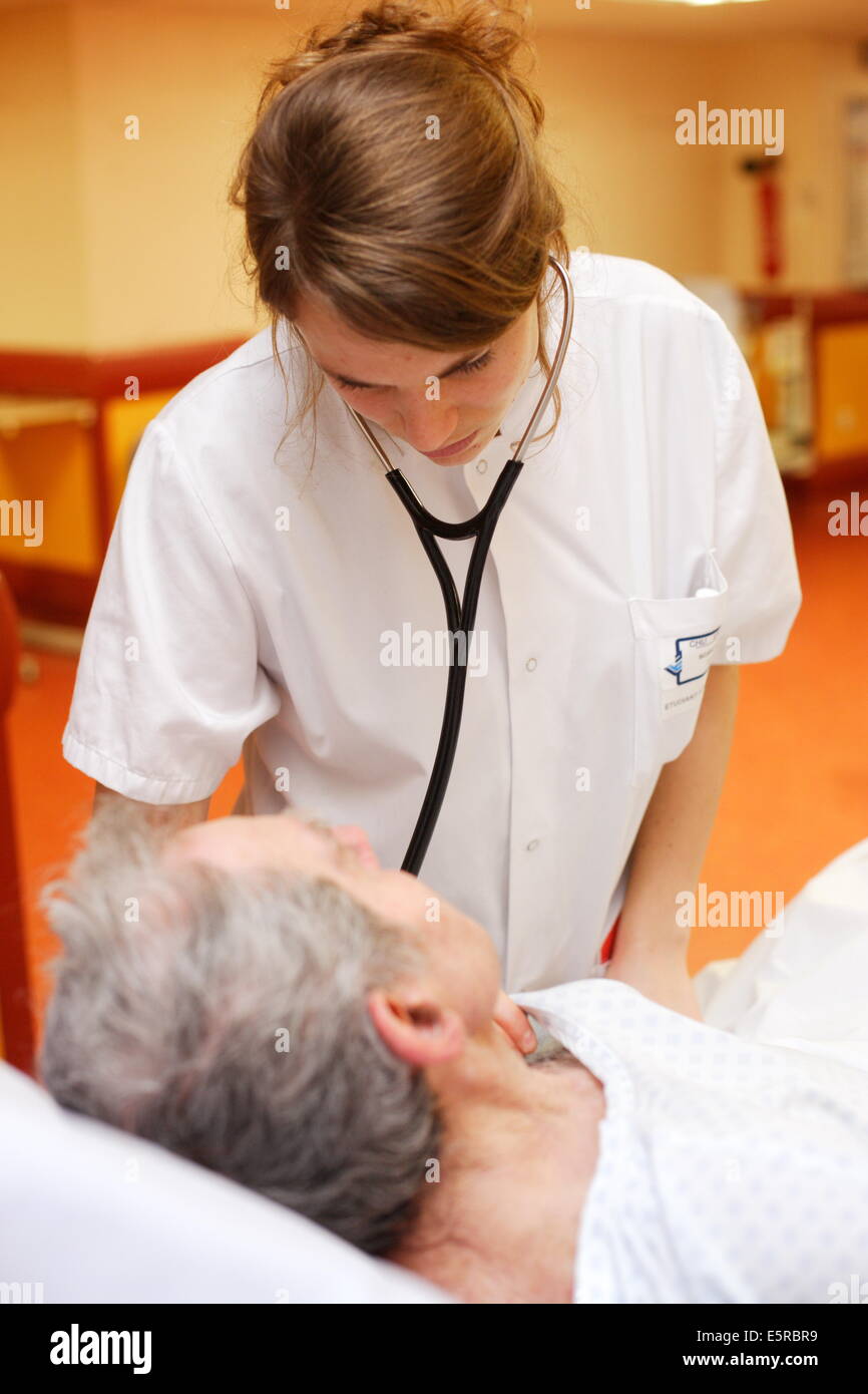 Intern doctor examining a patient, Emergency department, Limoges ...