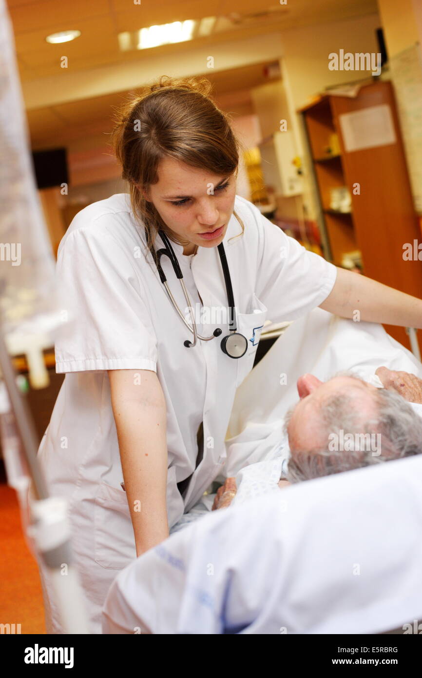 Intern doctor talking with a patient, Emergency department, Limoges ...