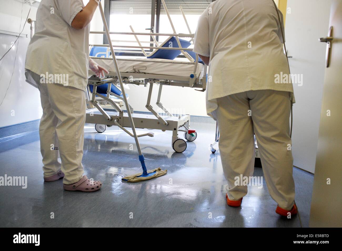 Staff cleaning the floor of a ward Stock Photo - Alamy