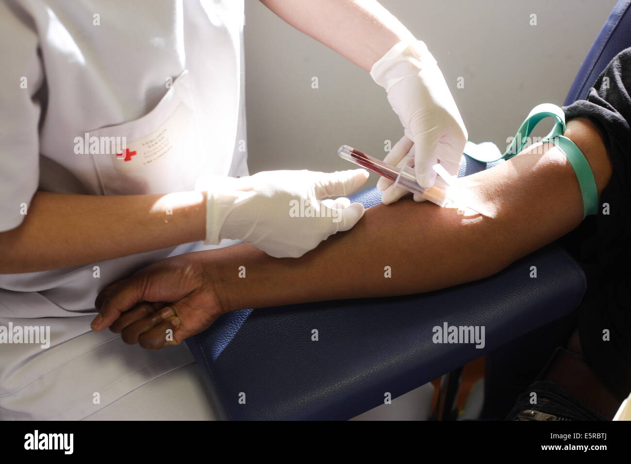 Nurse performing blood sample Stock Photo - Alamy