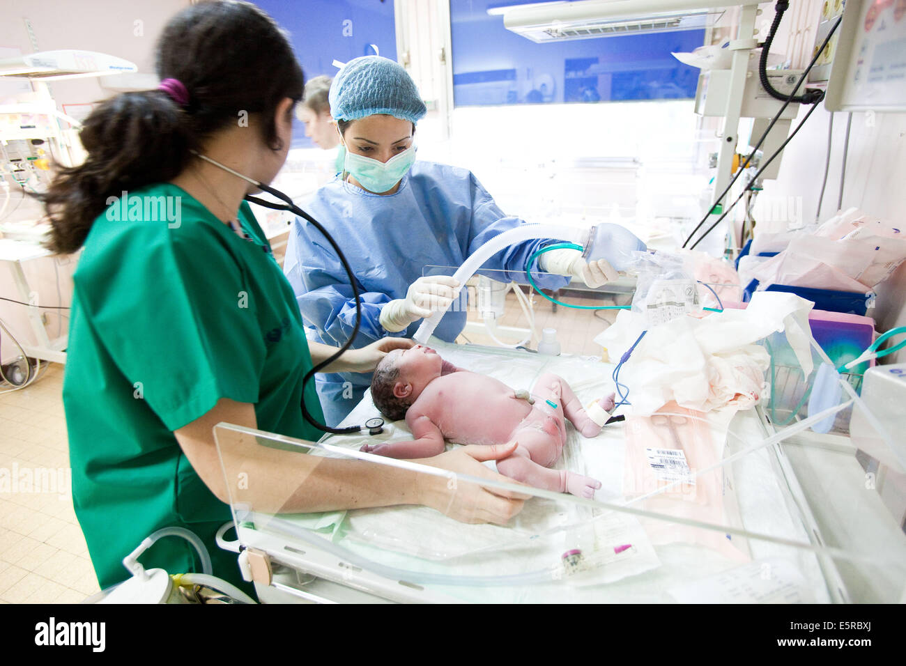Midwife taking care of a newborn baby, Maternity department, Cochin ...