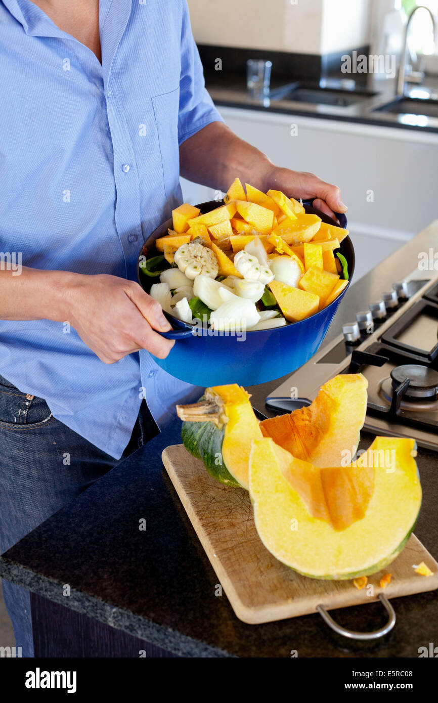 Man making soup Stock Photo - Alamy