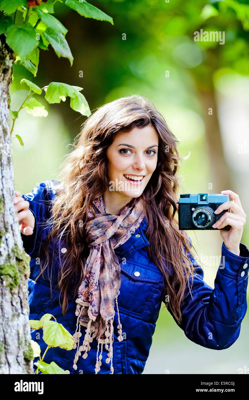 Woman using camera Stock Photo - Alamy