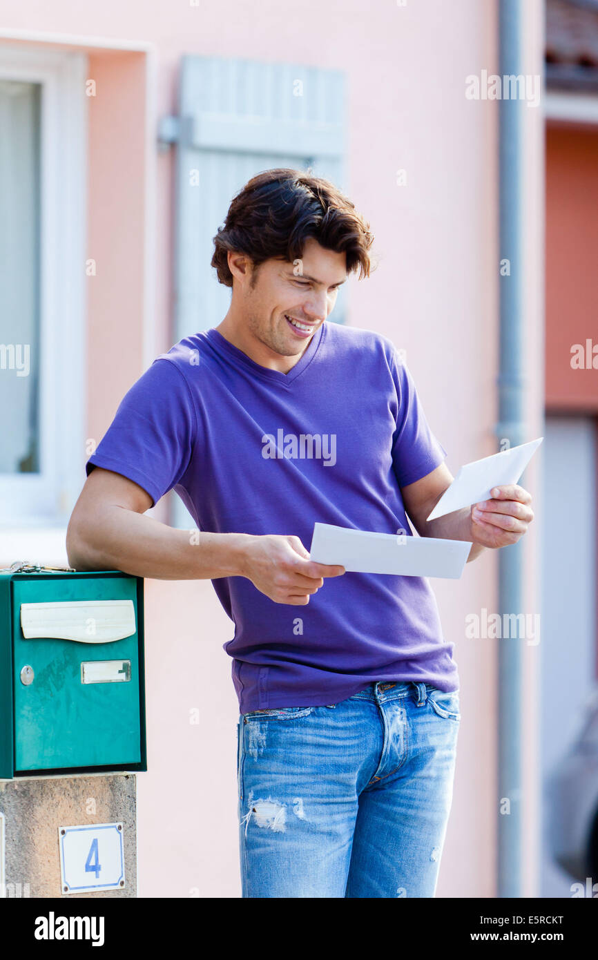 Man receiving letters Stock Photo - Alamy