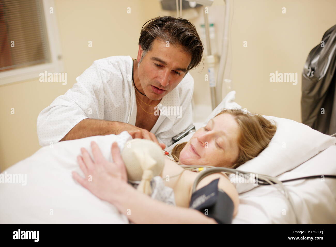 Mother in recovery room after a Caesarian delivery, Obstetrics and ...