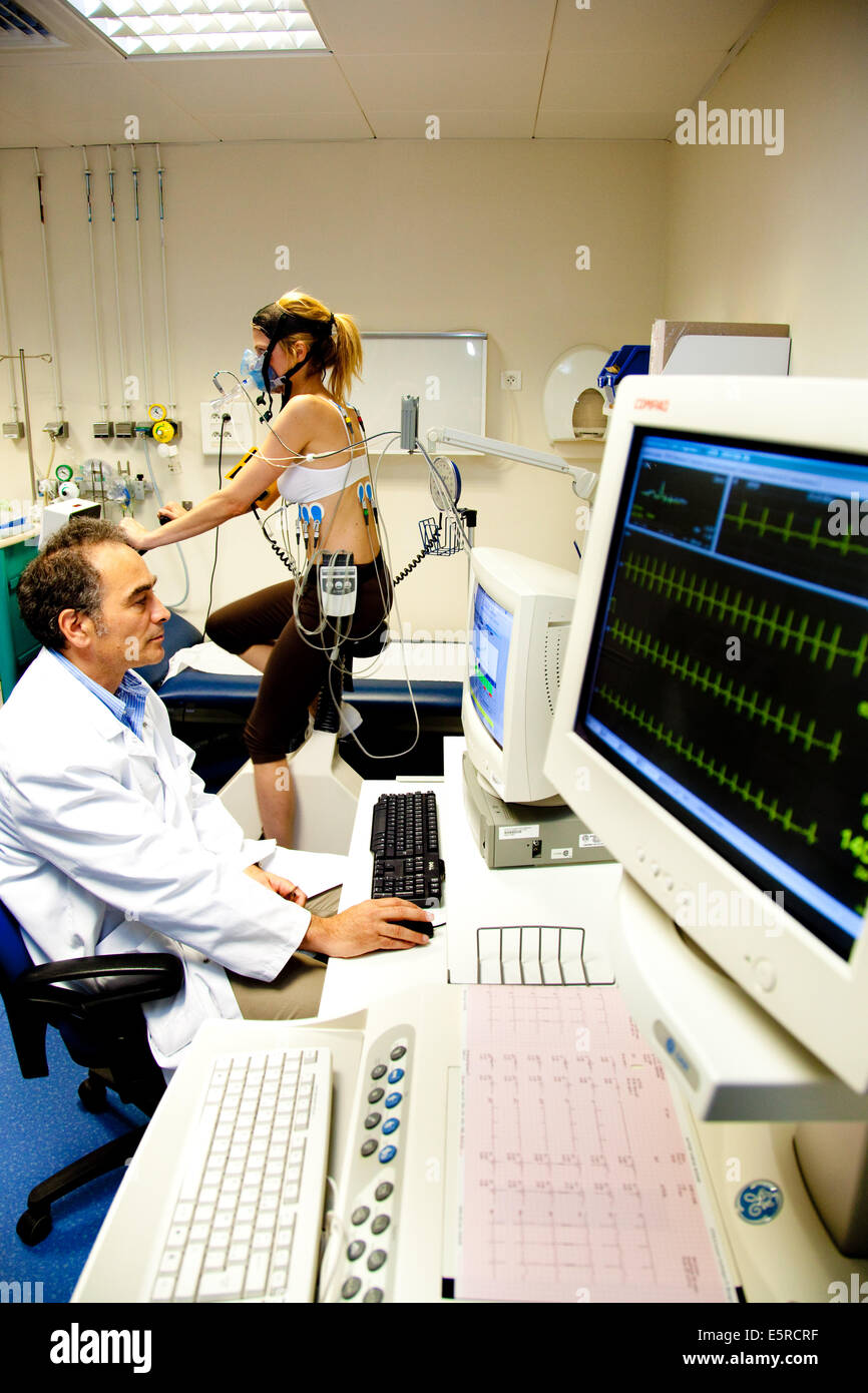 Woman undergoing a stress test and a lung function test, Department of ...