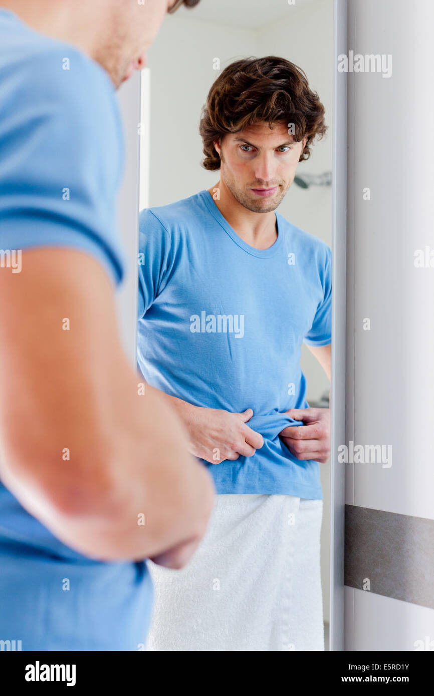 Fat belly checking man not woman hi-res stock photography and images ...