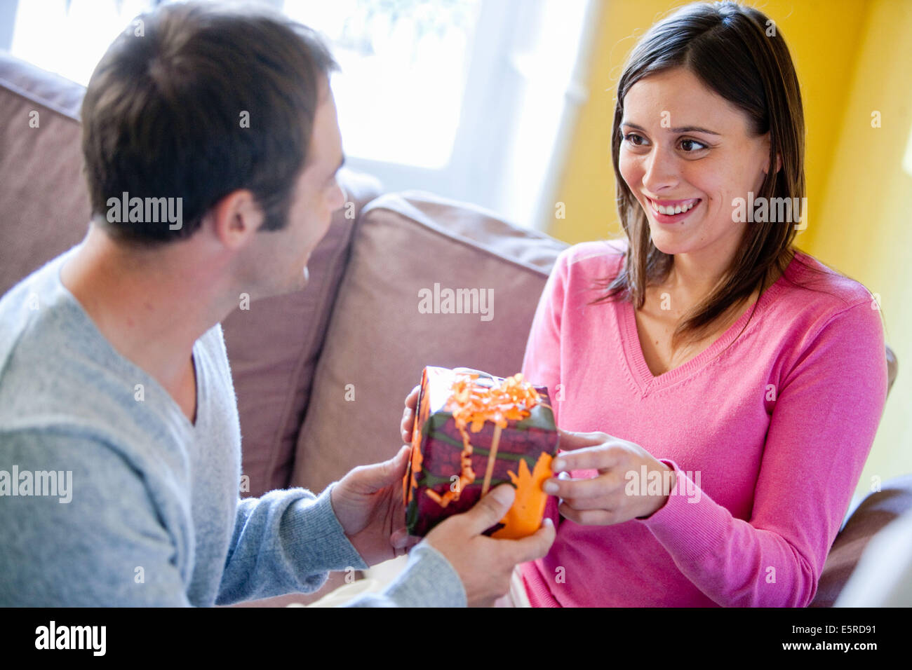 Woman receiving a present Stock Photo - Alamy