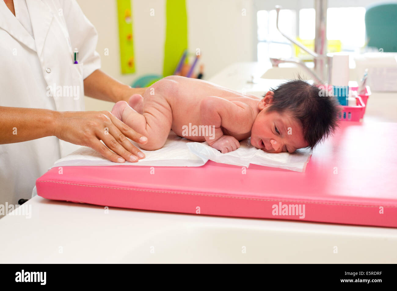Pediatrician examining a newborn baby, Obstetrics and gynaecology ...