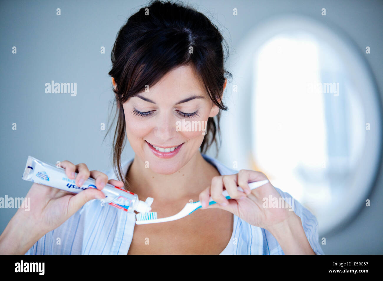 Woman brushing her teeth Stock Photo - Alamy