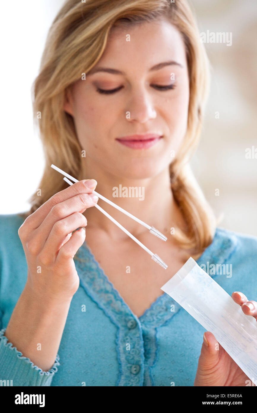 Woman using DNA test Stock Photo - Alamy