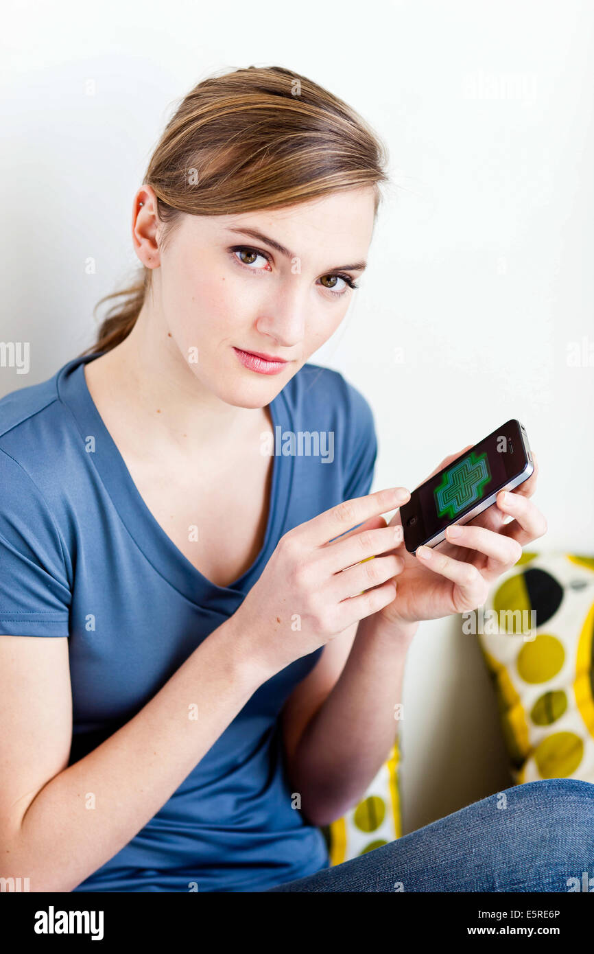 Woman using health application on her Iphone® Stock Photo - Alamy