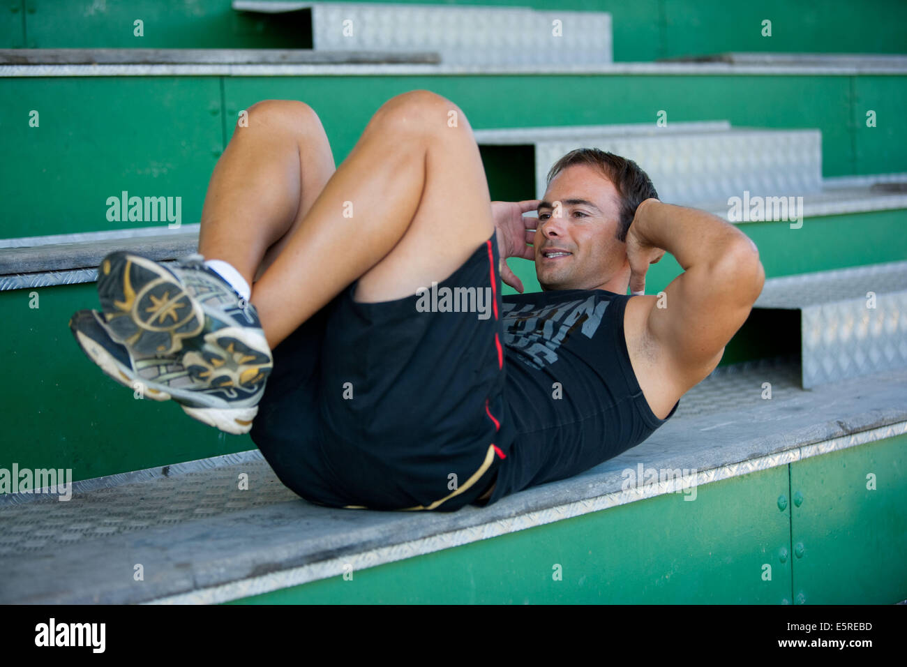 Man doing sit-ups Stock Photo - Alamy